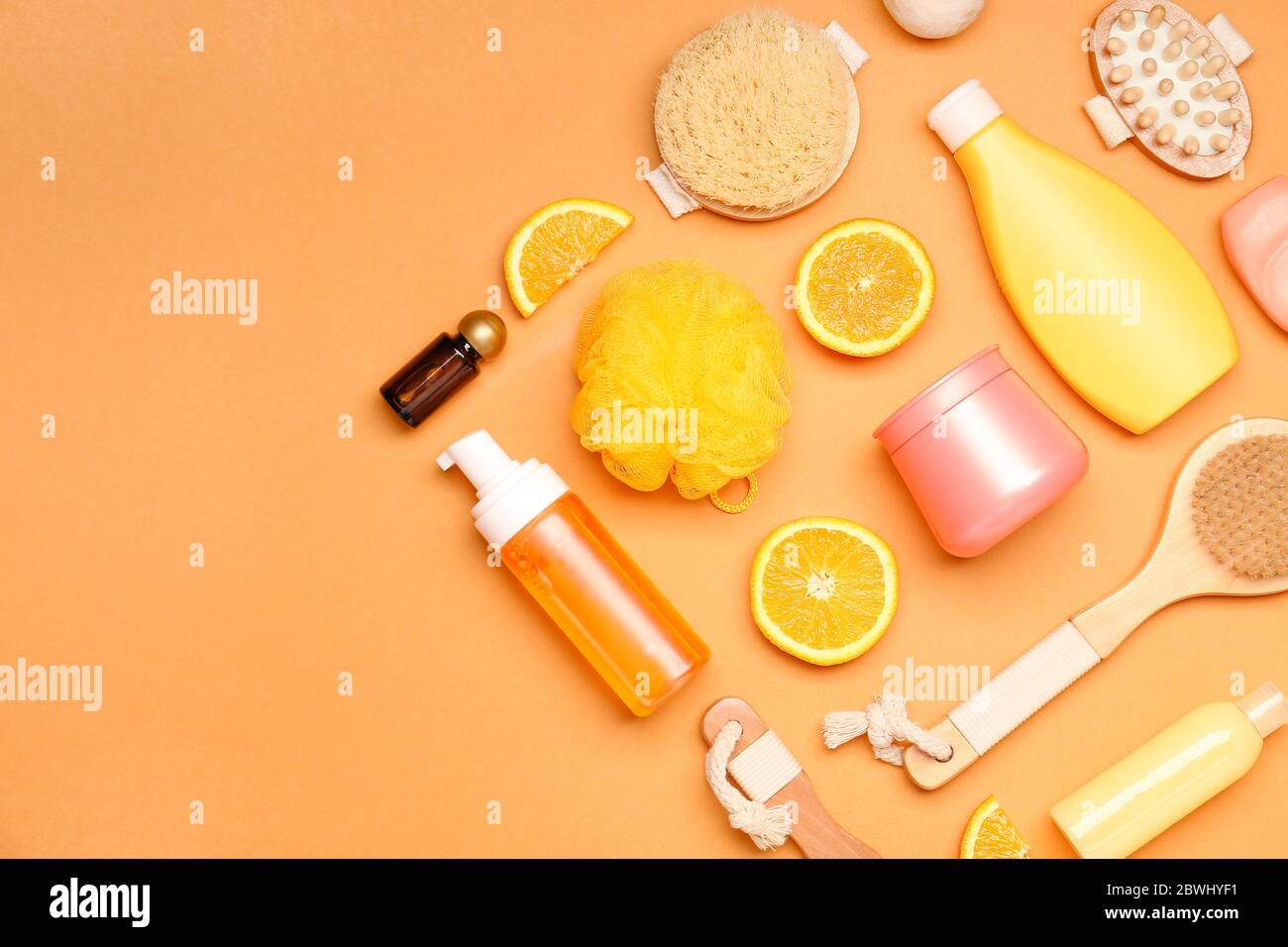 Shower gels with bath supplies on color background Stock Photo - Alamy