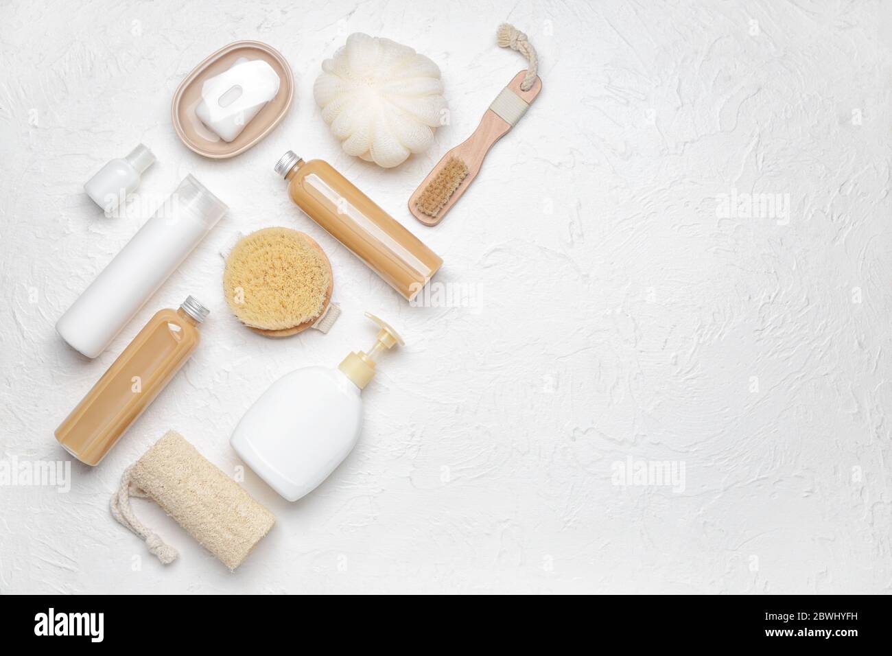 Shower gels with bath supplies on white background Stock Photo - Alamy