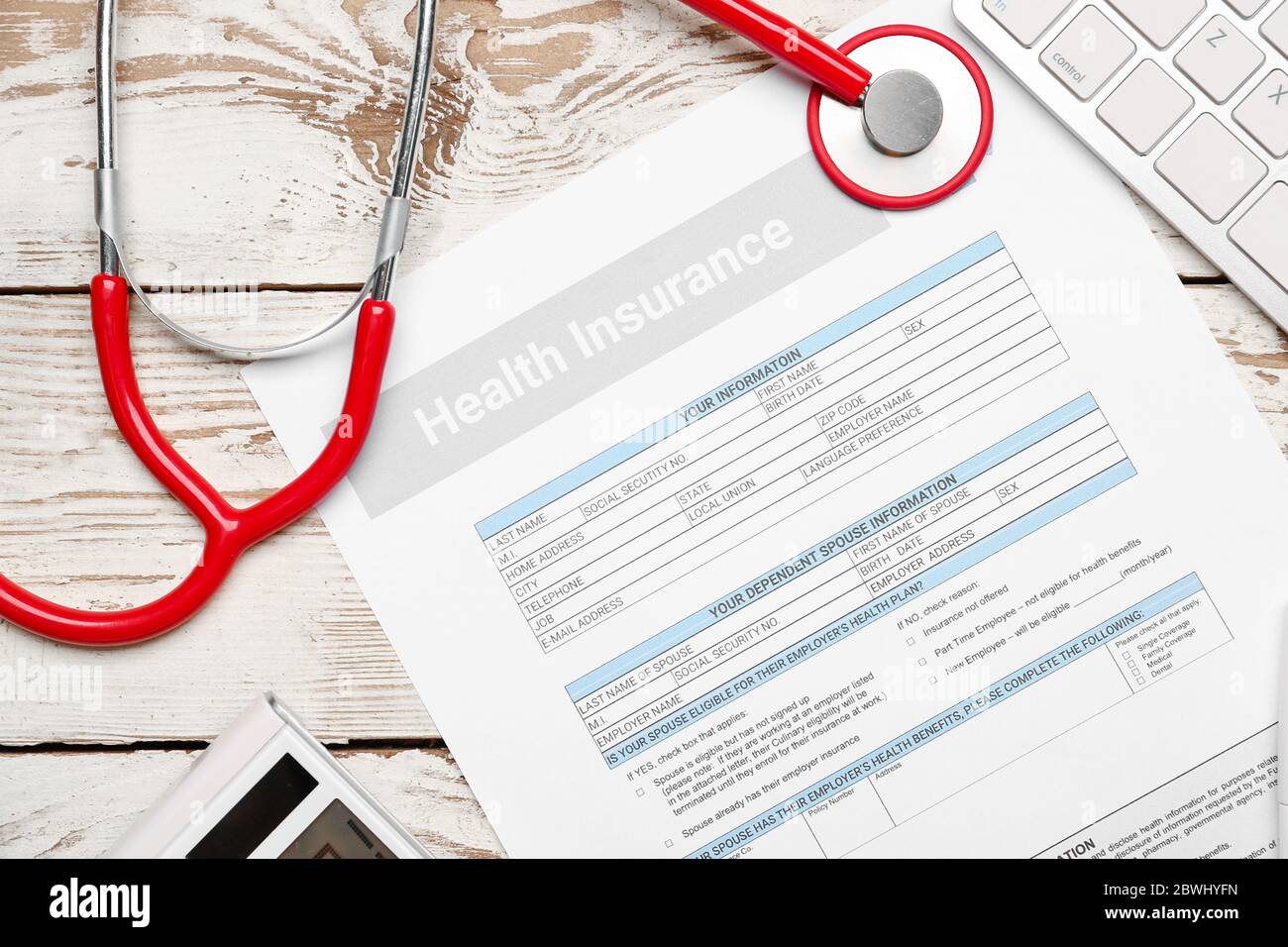 Health insurance form with stethoscope on table Stock Photo - Alamy