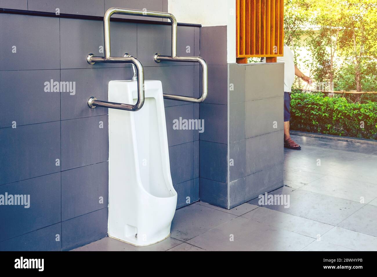 Clean and modern public men toilet with friendly design for people with ...