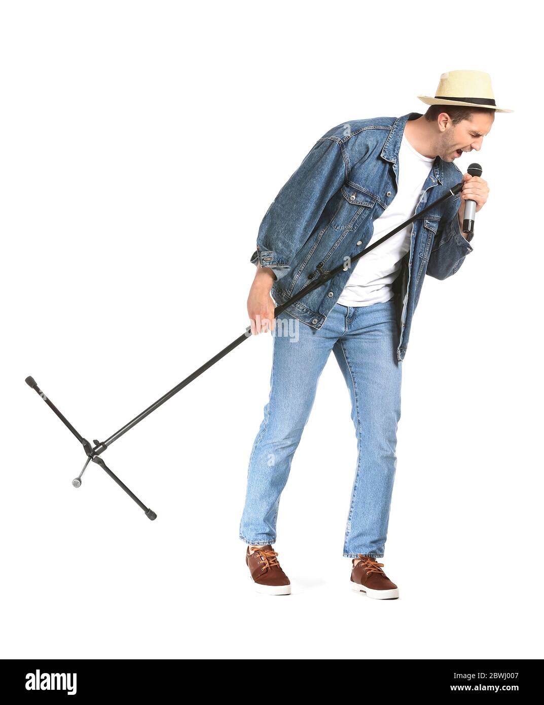 Young man singing on white background Stock Photo - Alamy