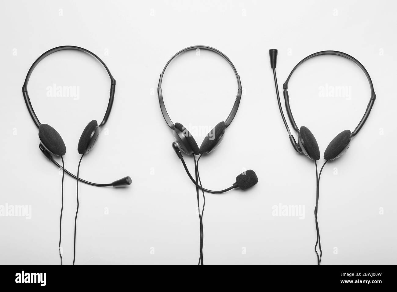 Modern headsets on white background Stock Photo - Alamy