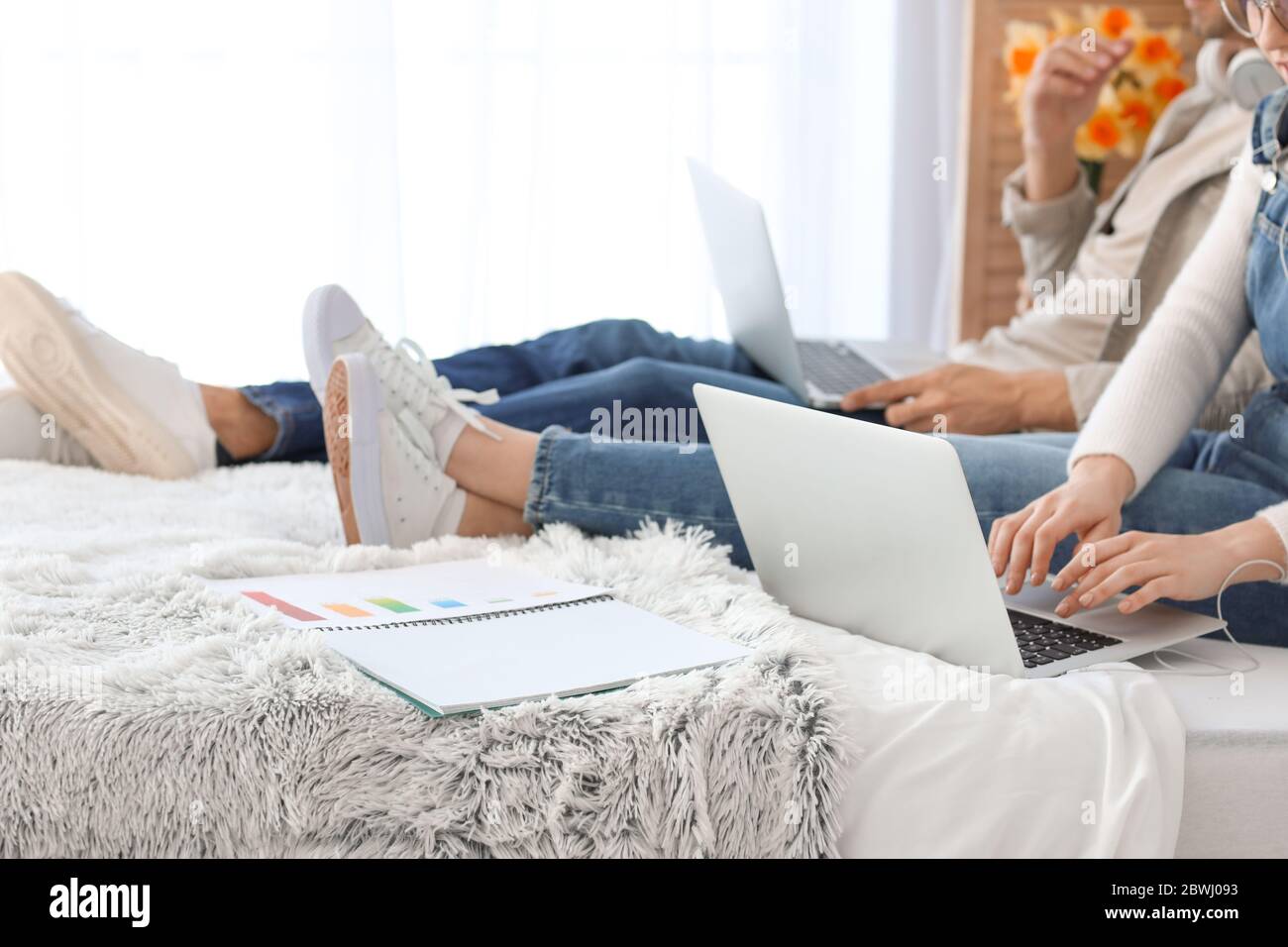 Young couple working together at home Stock Photo - Alamy