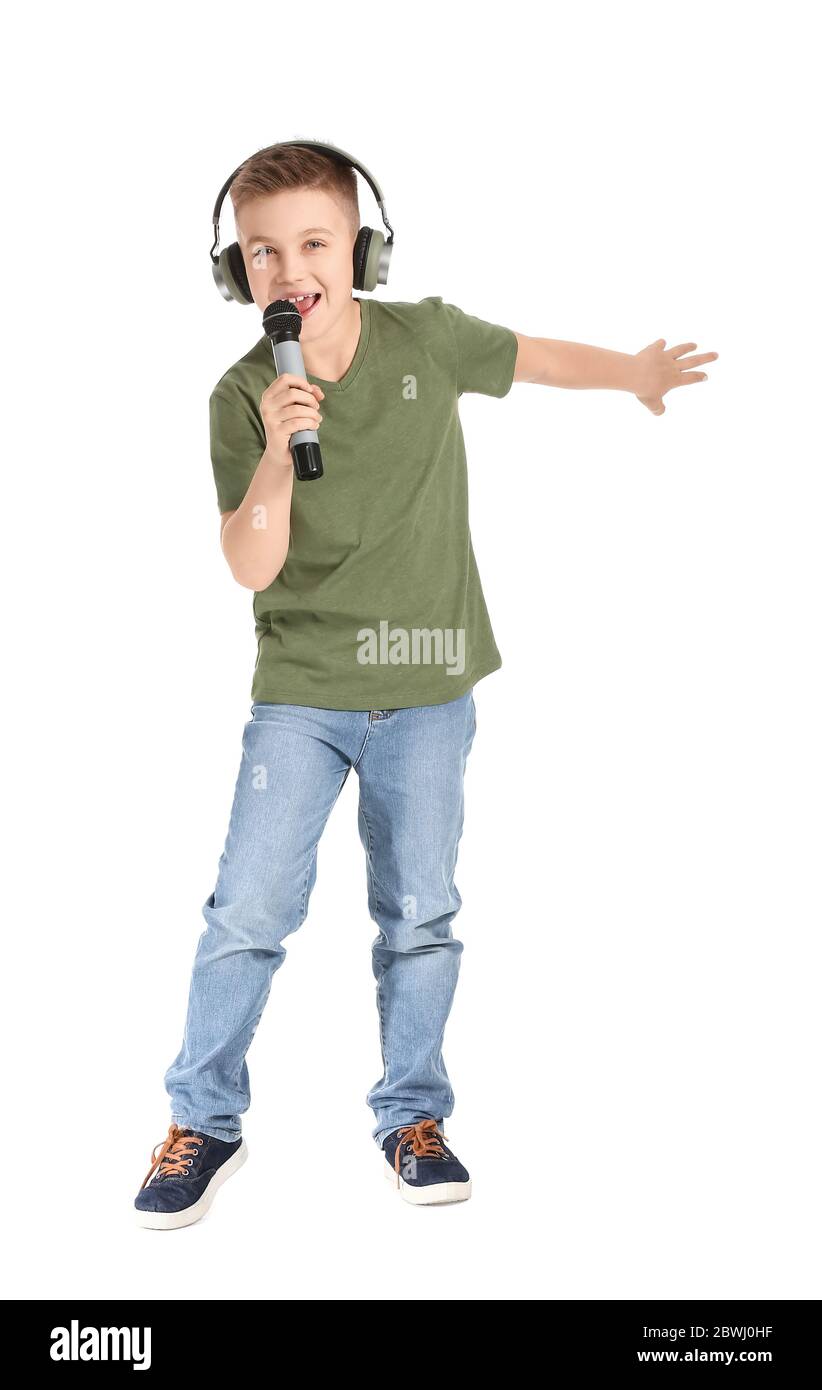 Cute little boy singing against white background Stock Photo - Alamy