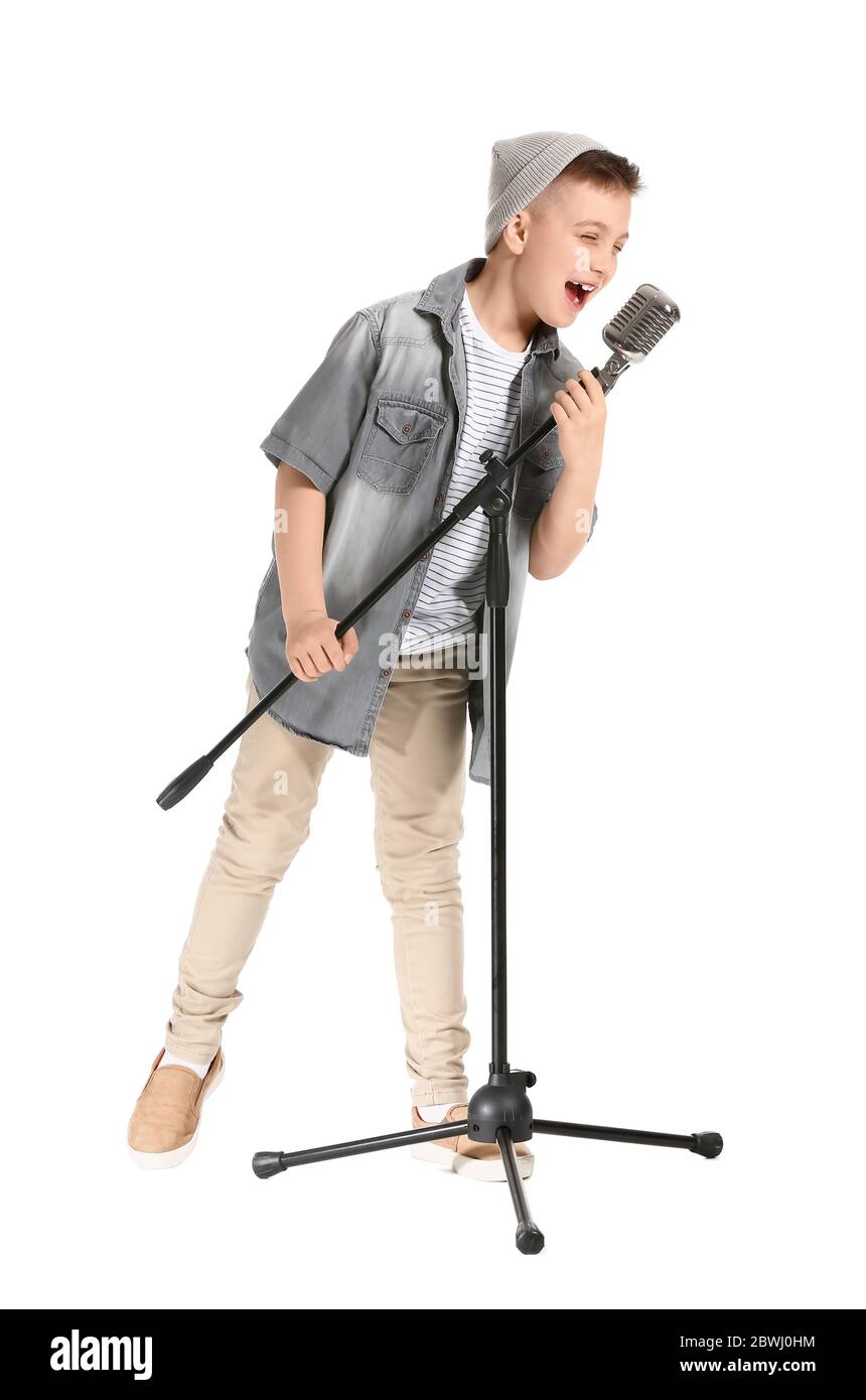 Cute little boy singing against white background Stock Photo - Alamy