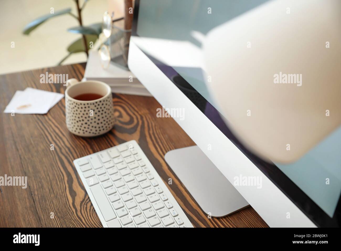 Modern workplace with computer in room Stock Photo - Alamy