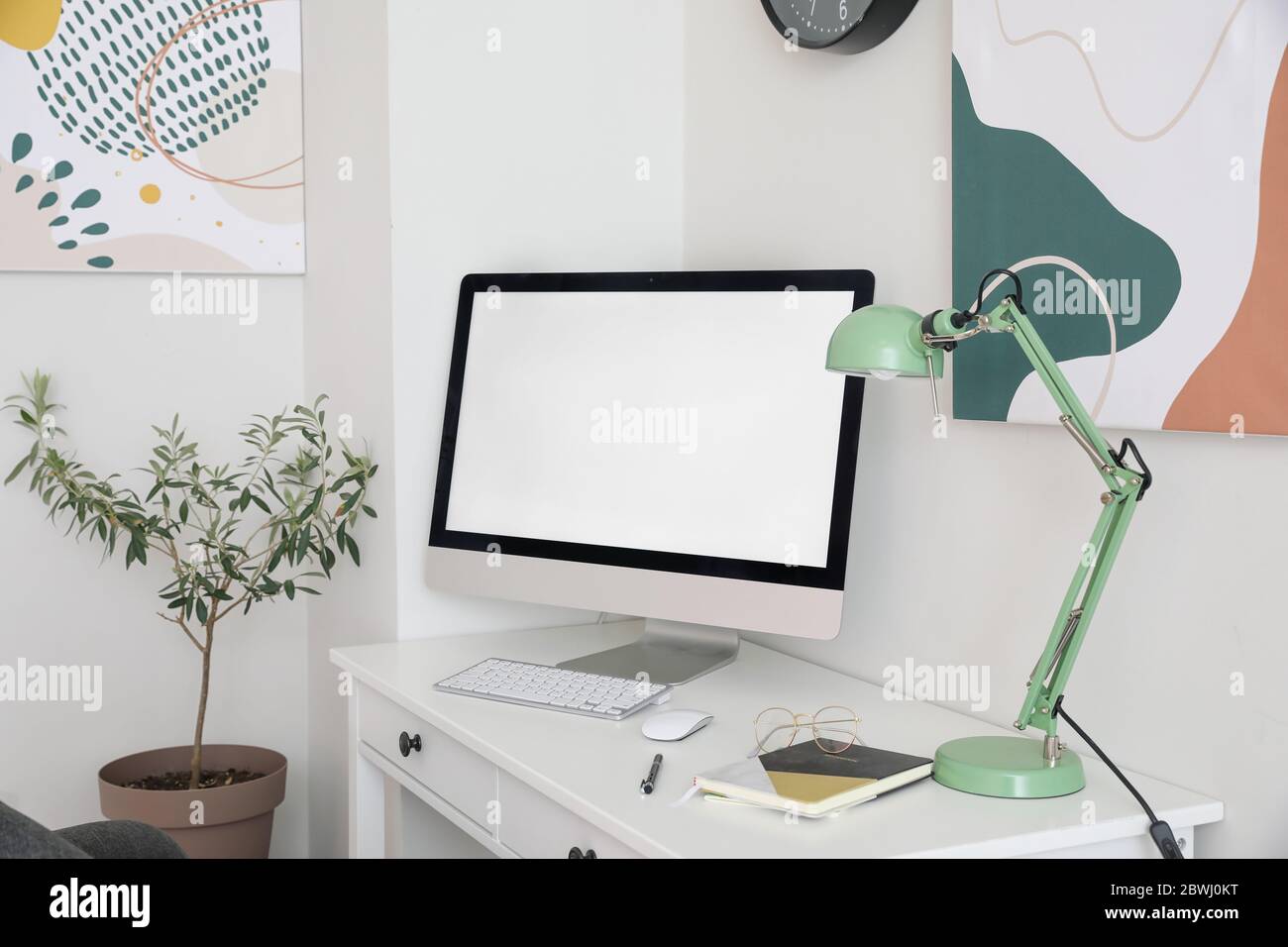 Modern workplace with computer in room Stock Photo - Alamy