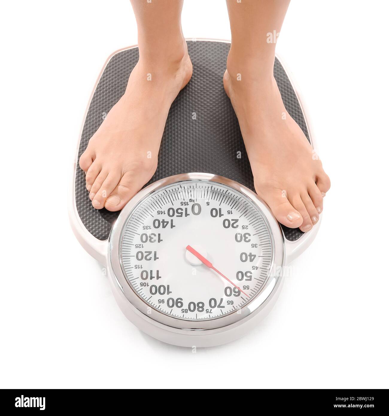 Young woman measuring her weight on white background Stock Photo - Alamy