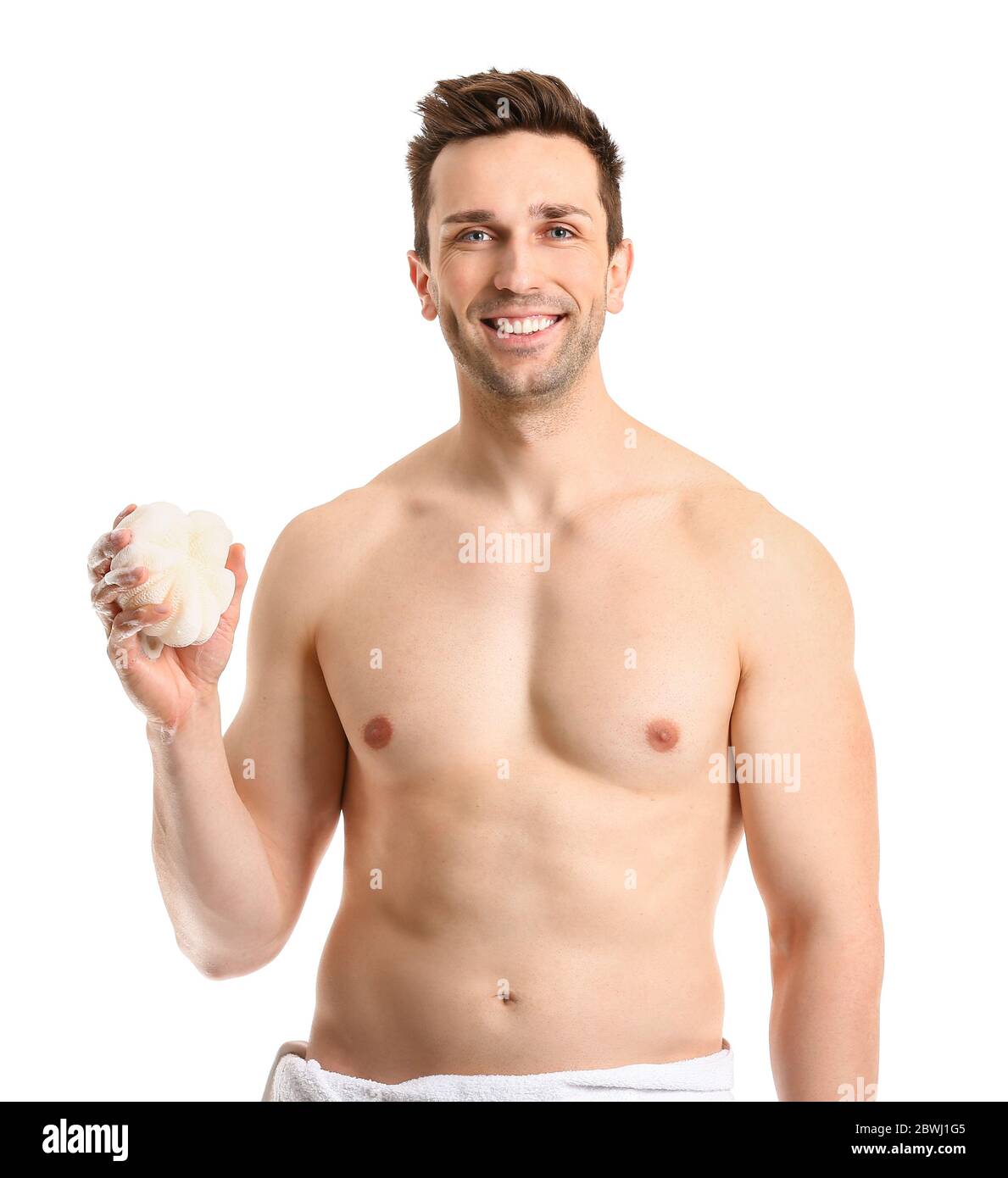 Handsome man with loofah on white background Stock Photo - Alamy