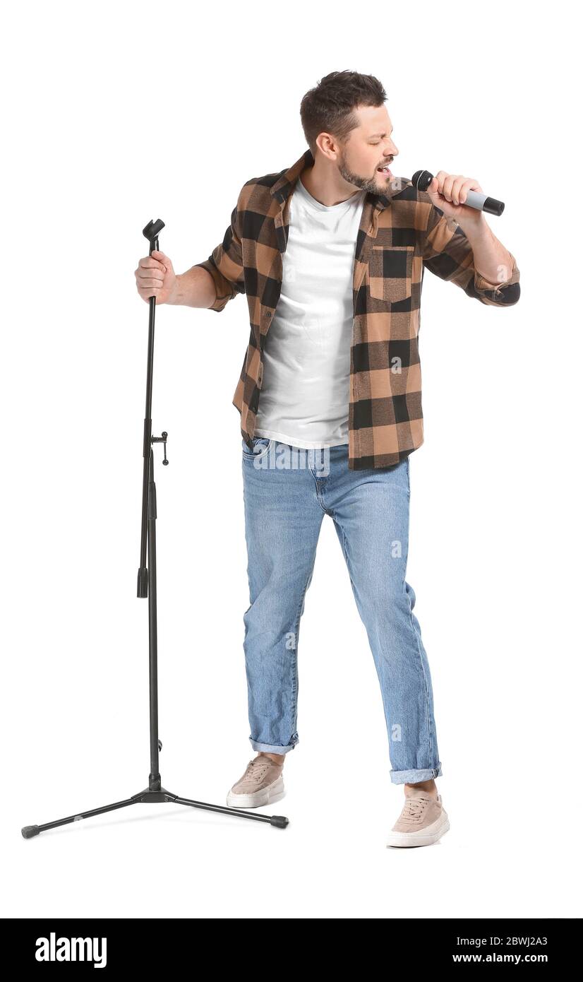Handsome man singing against white background Stock Photo - Alamy