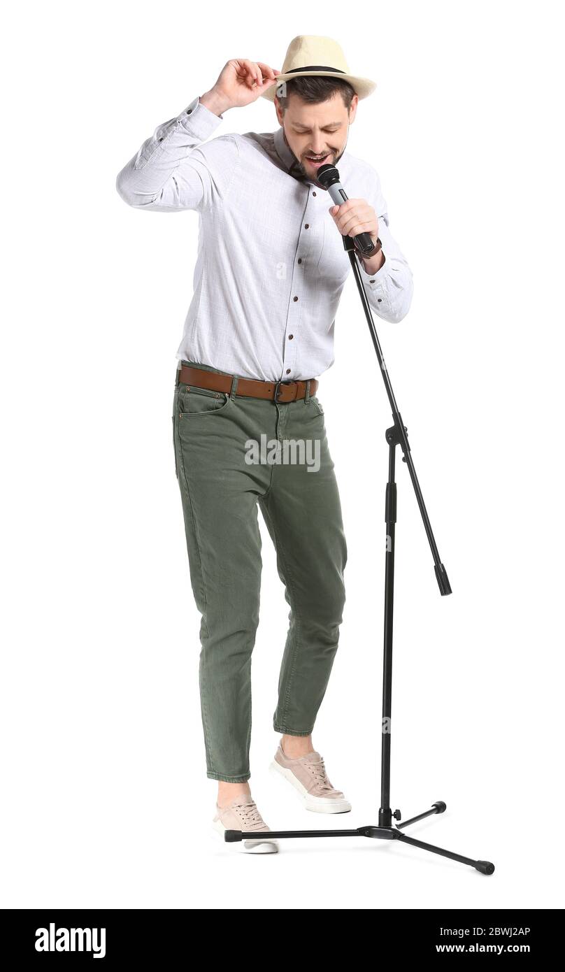 Handsome man singing against white background Stock Photo - Alamy