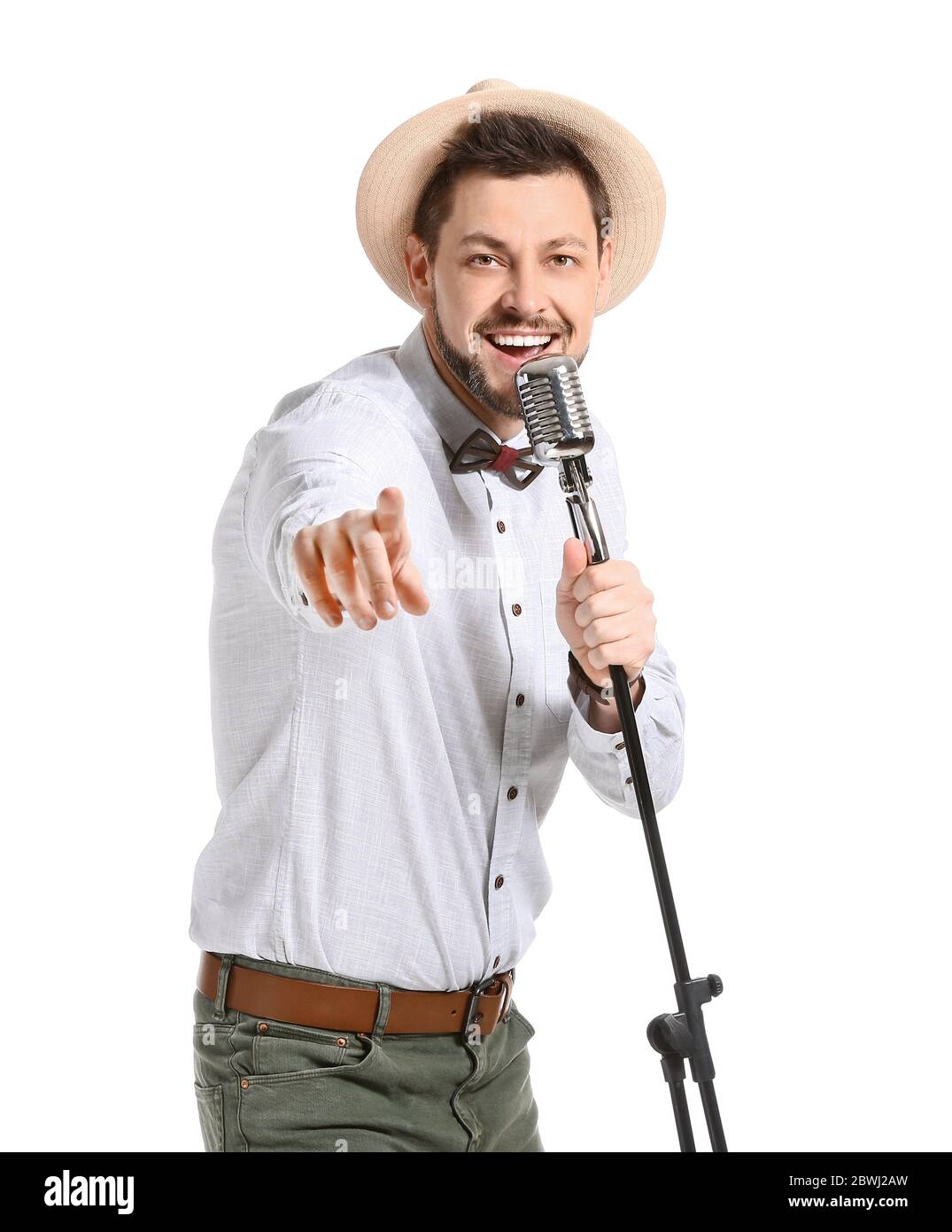 Handsome man singing against white background Stock Photo - Alamy