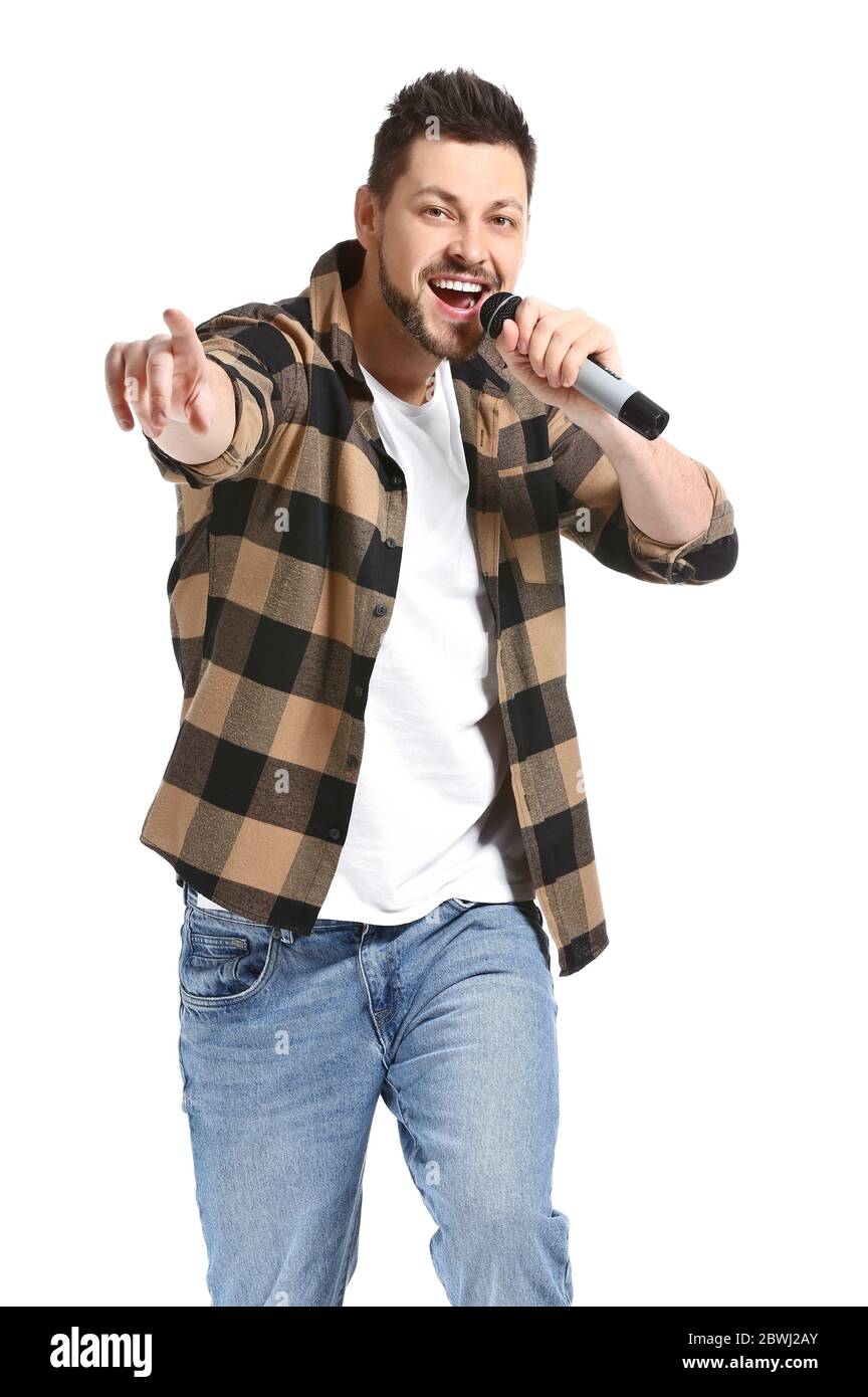 Handsome man singing against white background Stock Photo - Alamy