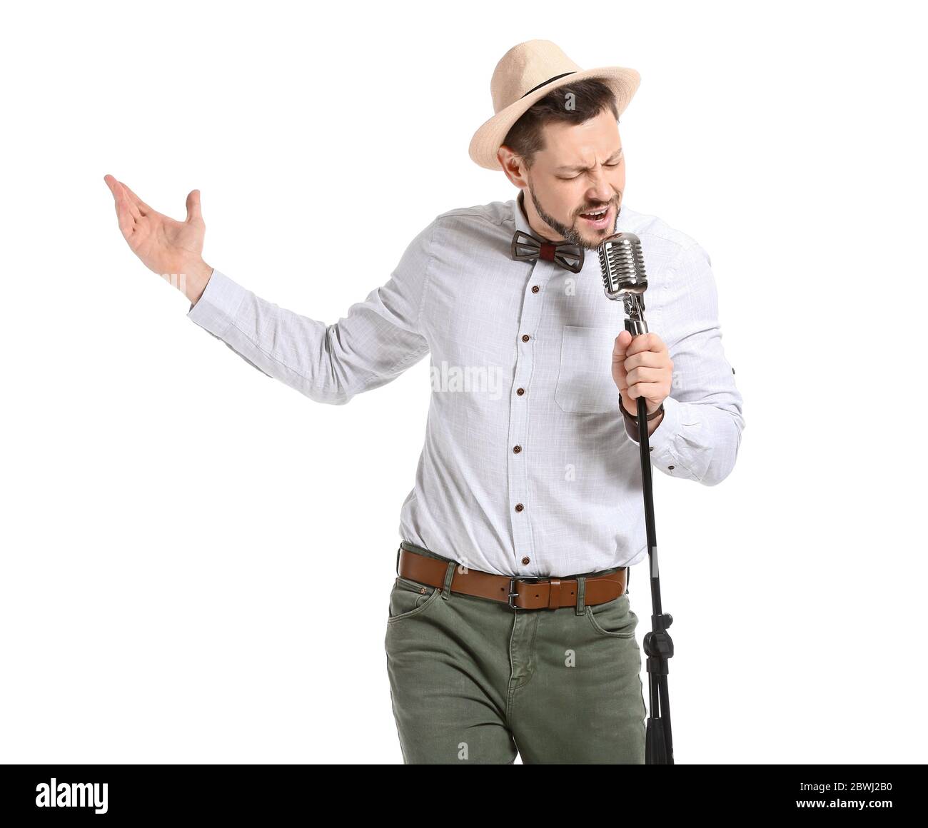 Handsome man singing against white background Stock Photo - Alamy