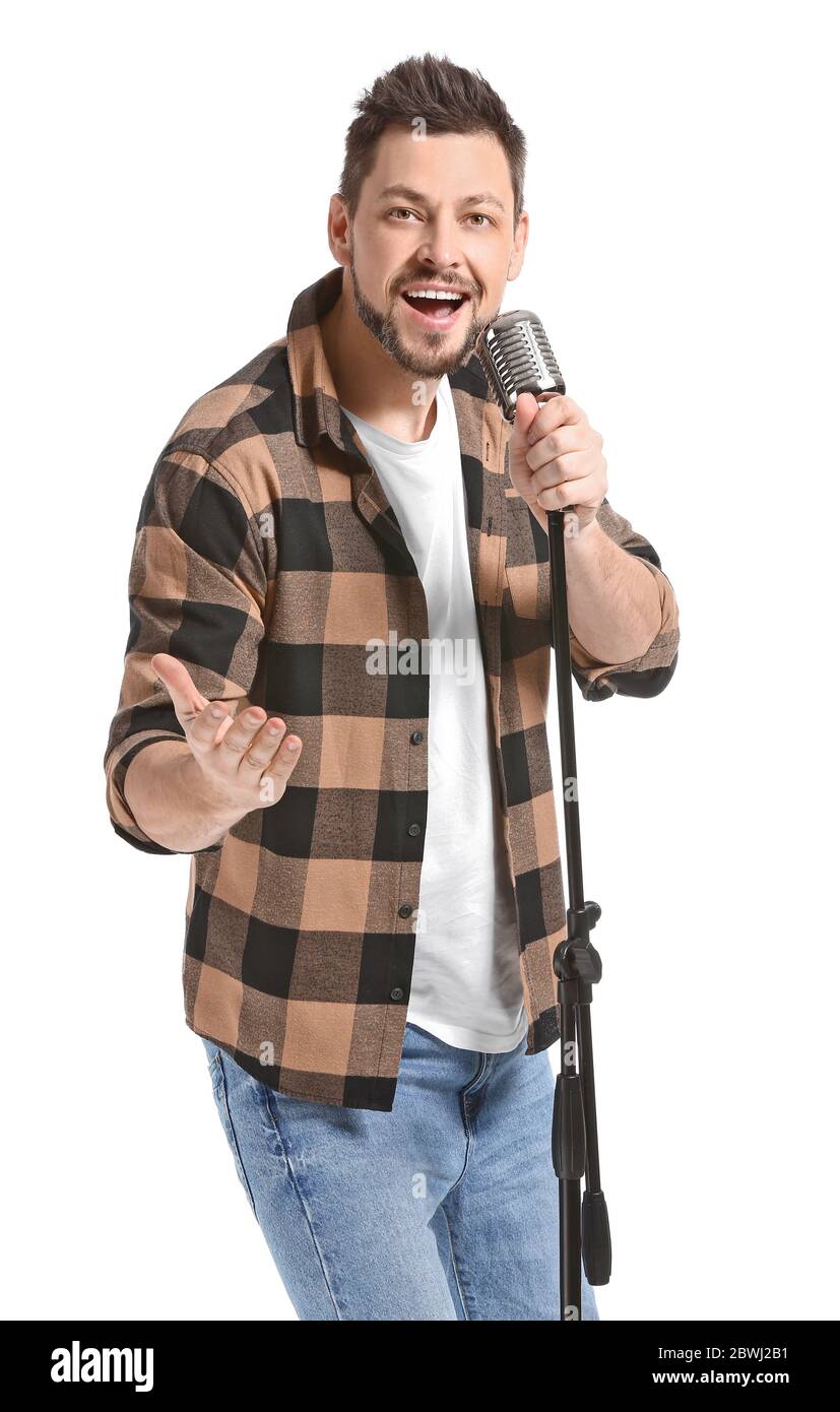 Handsome man singing against white background Stock Photo - Alamy