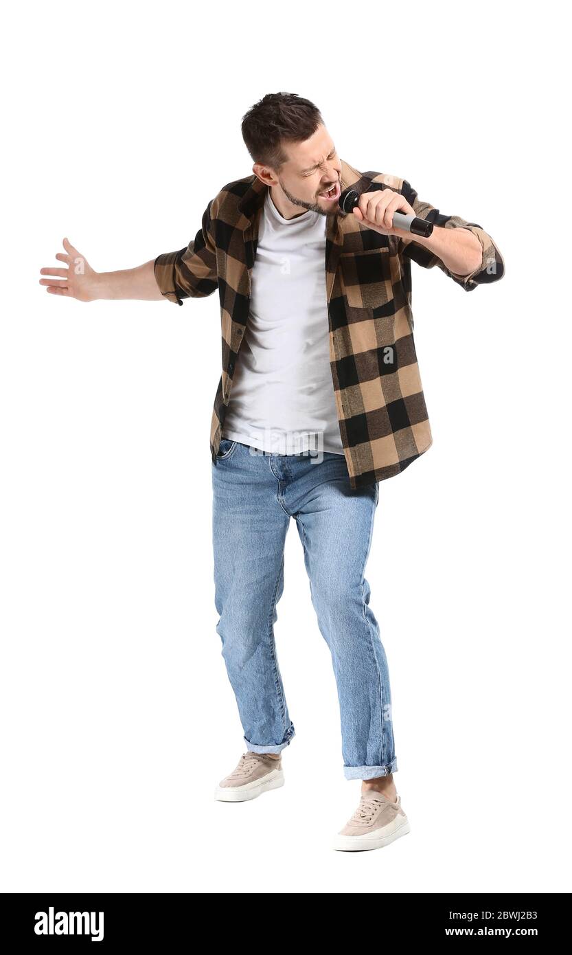 Handsome man singing against white background Stock Photo - Alamy