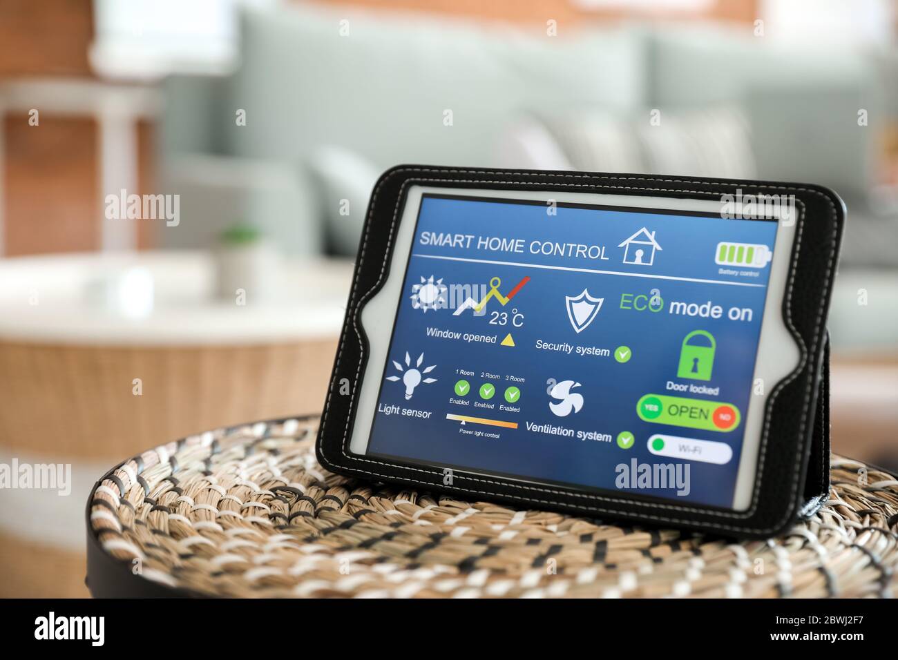 Tablet computer with application of smart home automation on table in ...
