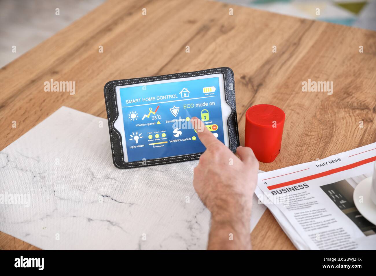 Man using application of smart home automation Stock Photo - Alamy