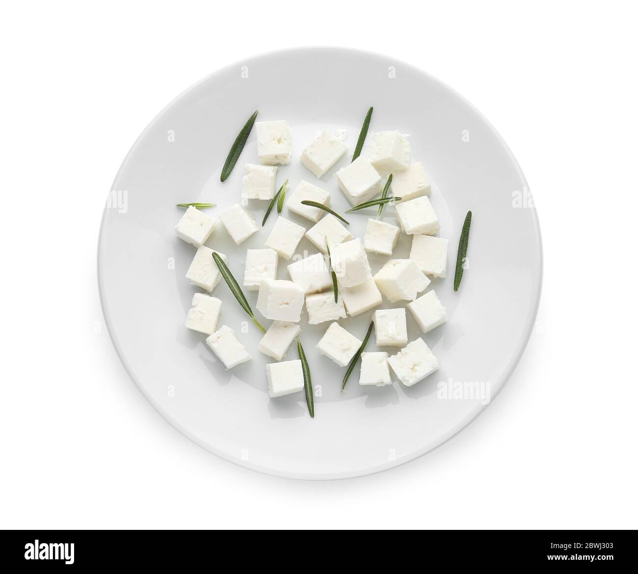 Plate with tasty cut feta cheese on white background Stock Photo - Alamy