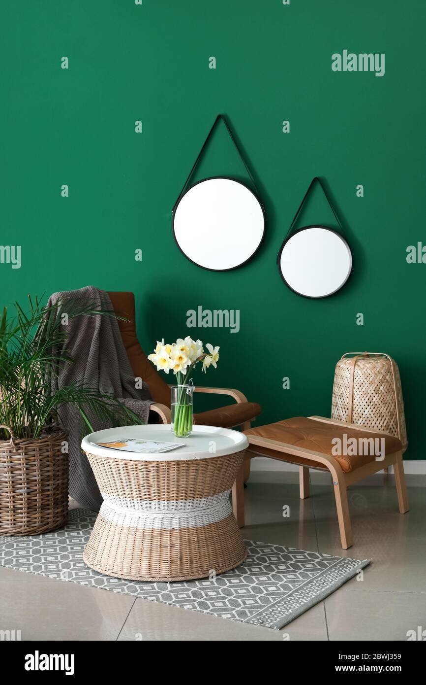 Interior of room with stylish mirrors and spring flowers Stock Photo ...