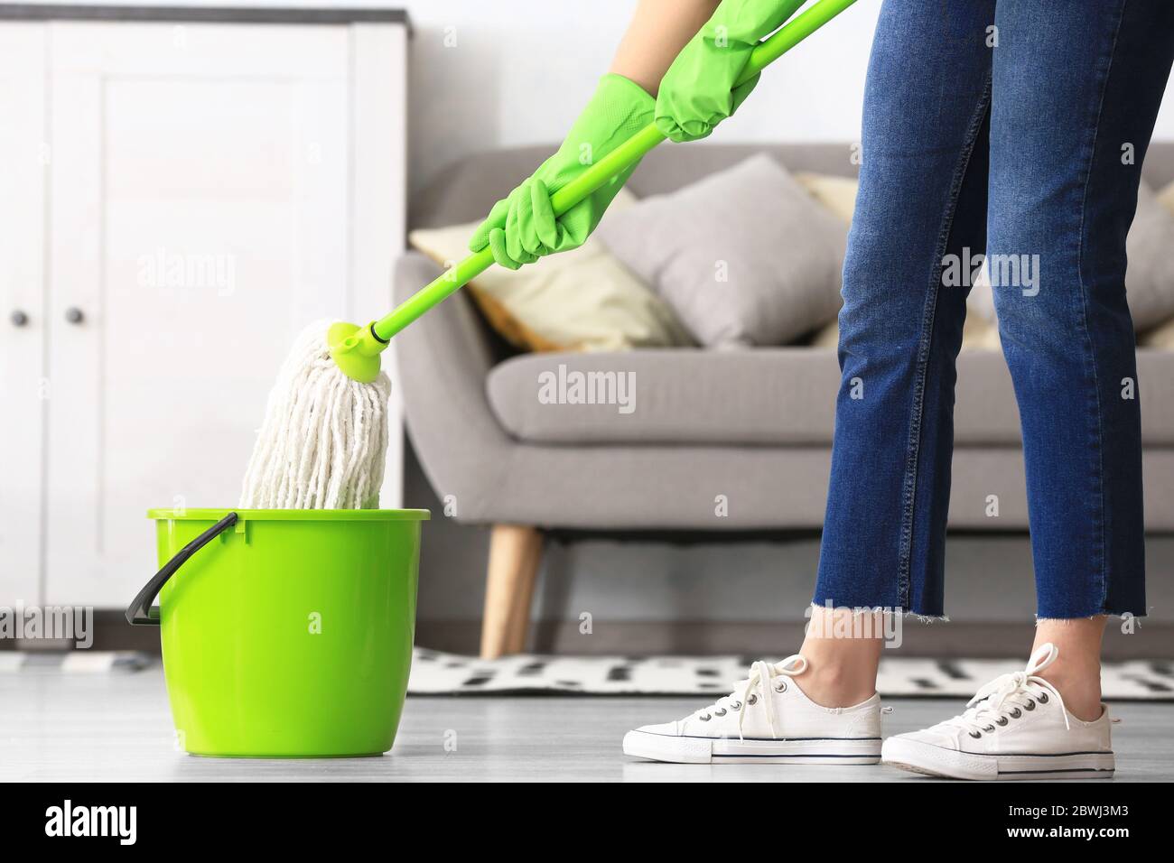 Woman legs mop bucket cleaning hi-res stock photography and images - Alamy