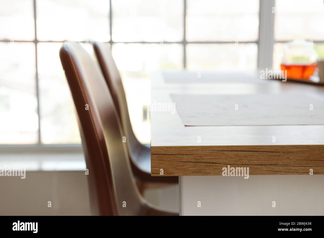 Big table in modern dining room Stock Photo - Alamy