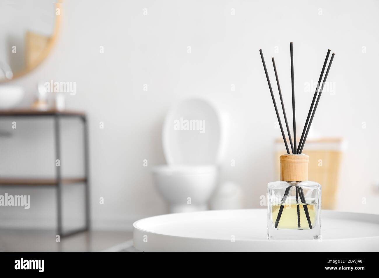 Reed diffuser in modern bathroom Stock Photo - Alamy