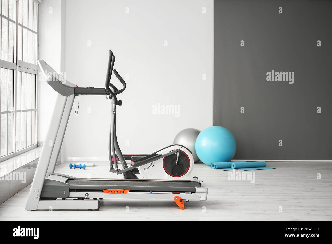 Interior of modern gym with exercise machines Stock Photo - Alamy
