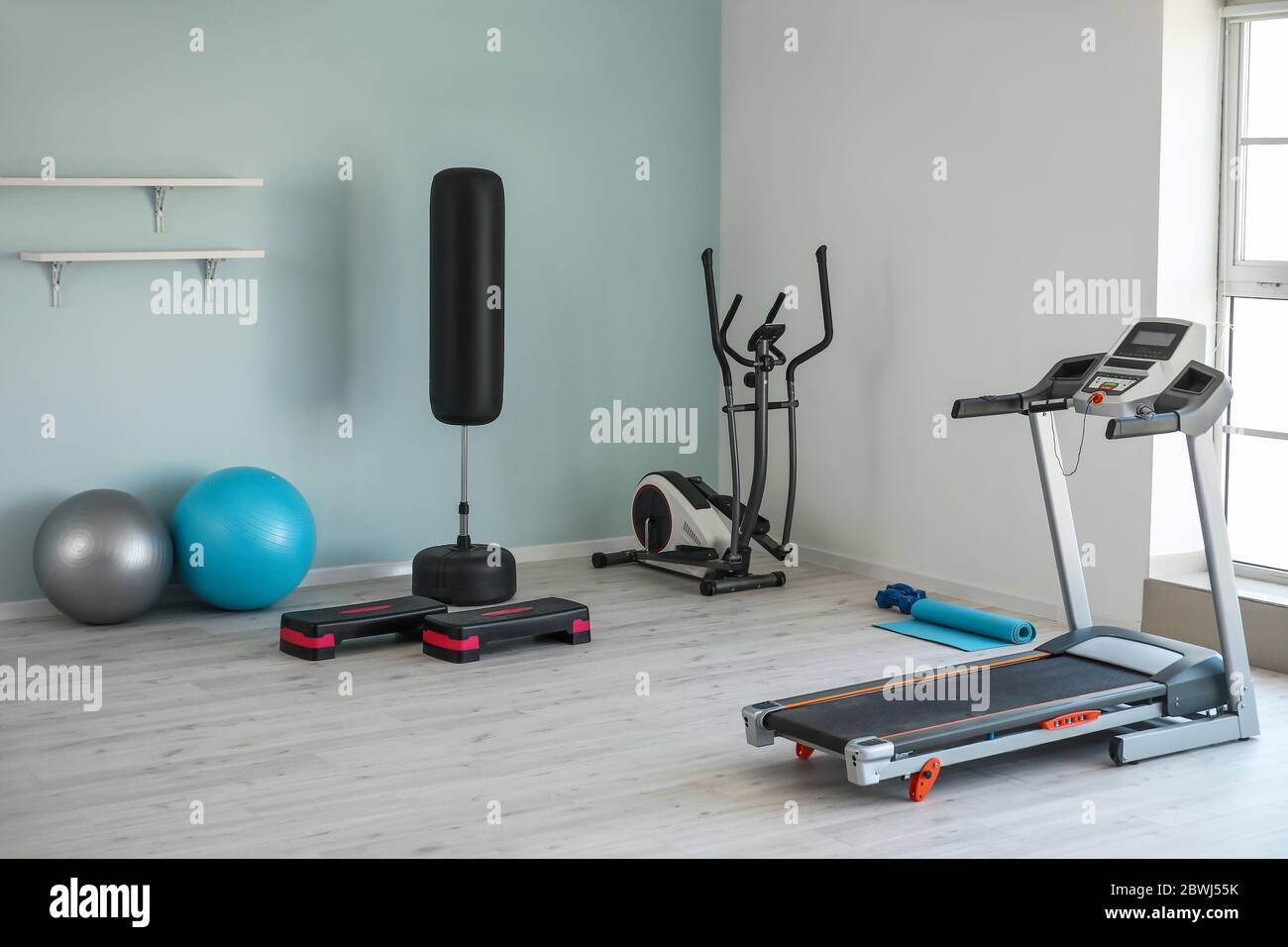 Interior of modern gym with exercise machines Stock Photo - Alamy