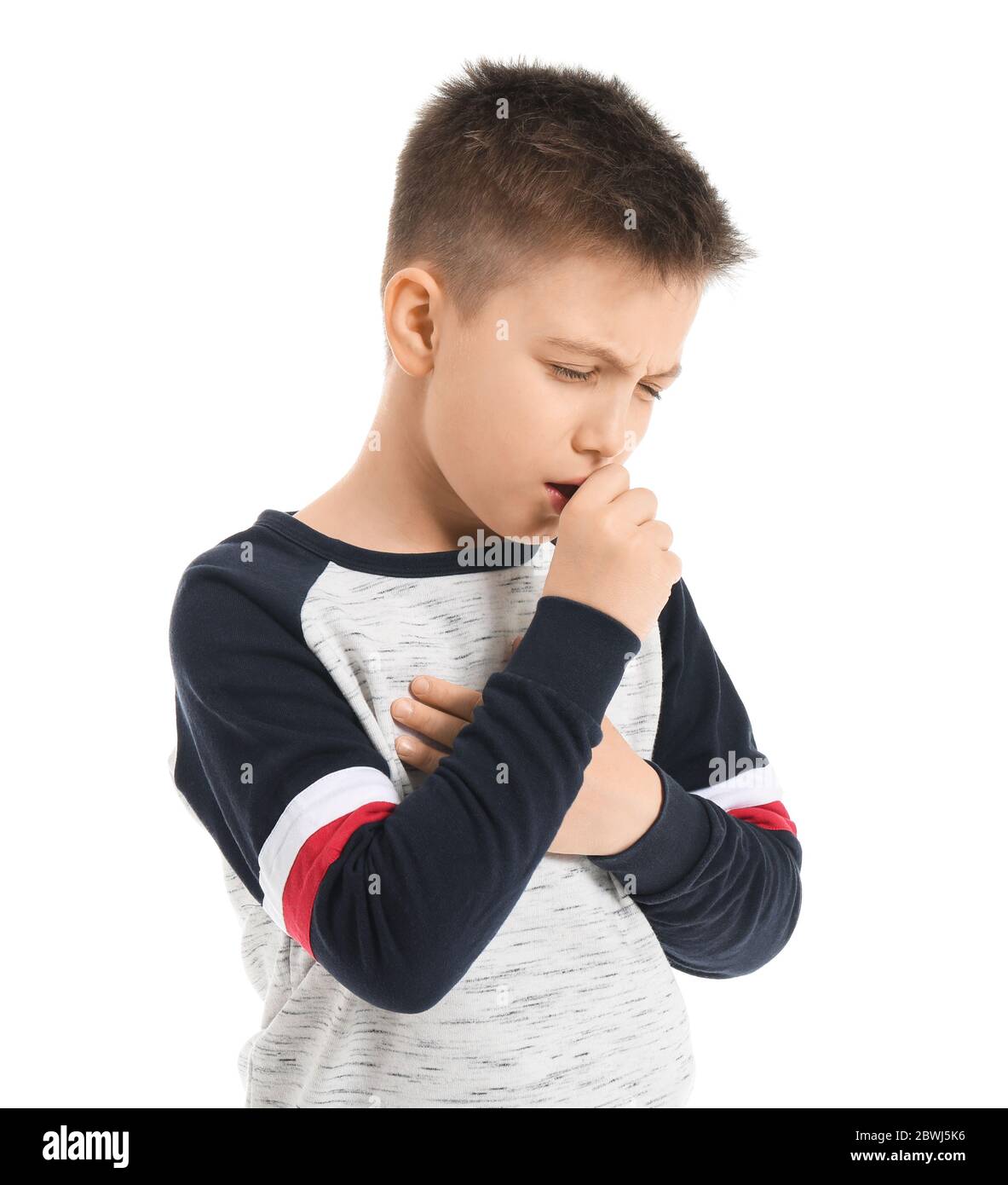Ill coughing little boy on white background Stock Photo - Alamy