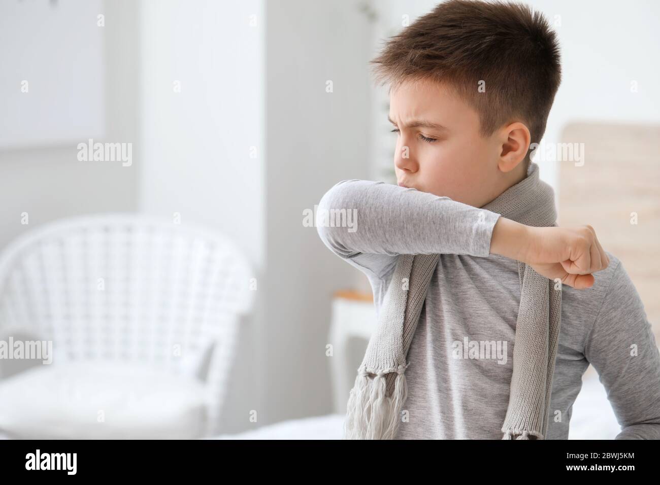 Ill coughing little boy at home Stock Photo - Alamy