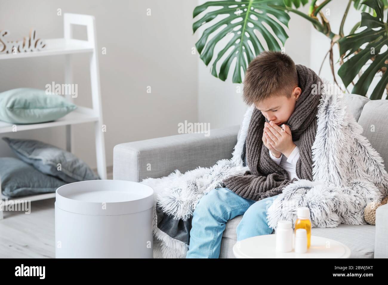 Ill coughing little boy at home Stock Photo - Alamy