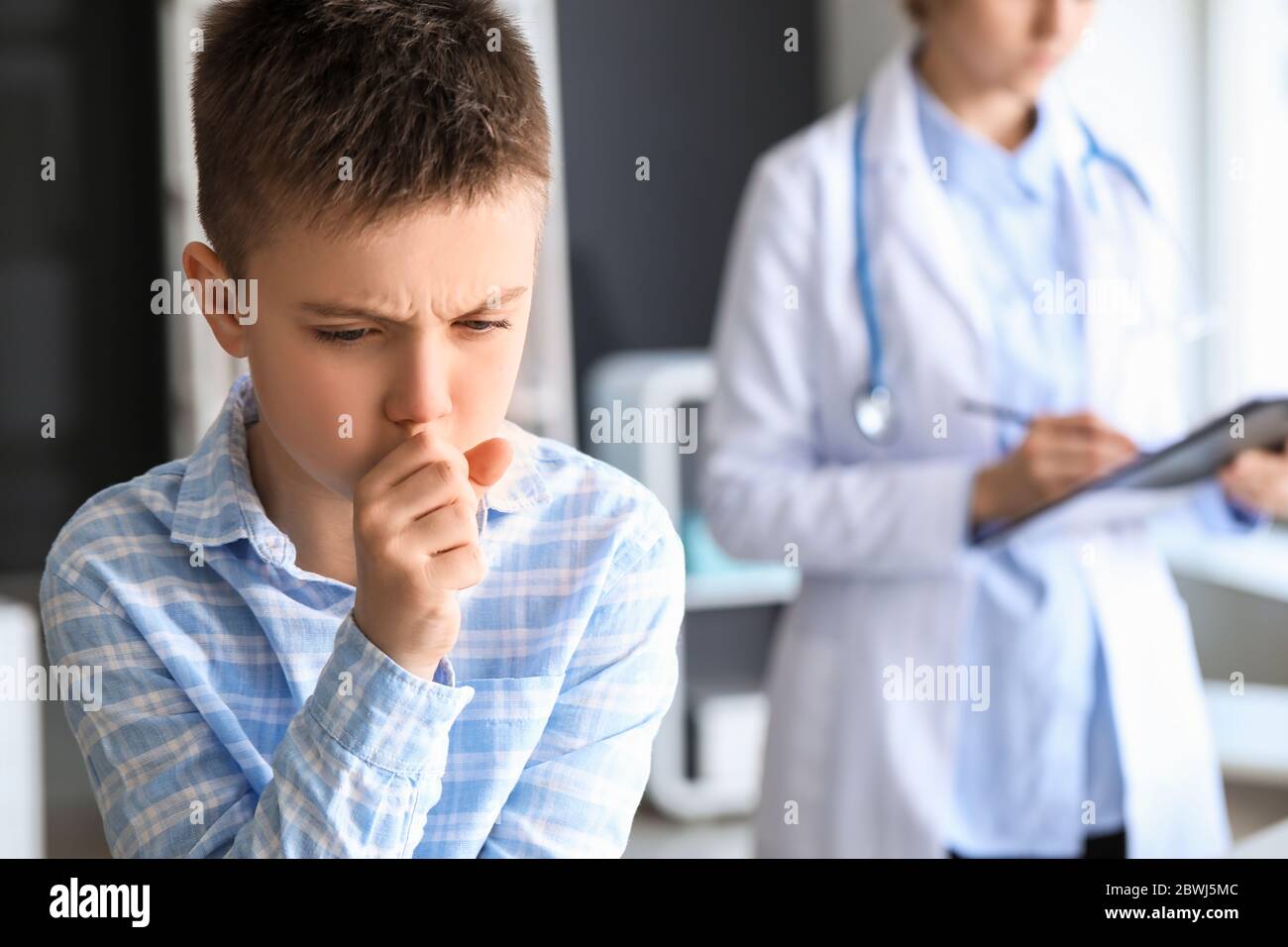 Female patient coughing at doctor hi-res stock photography and images ...