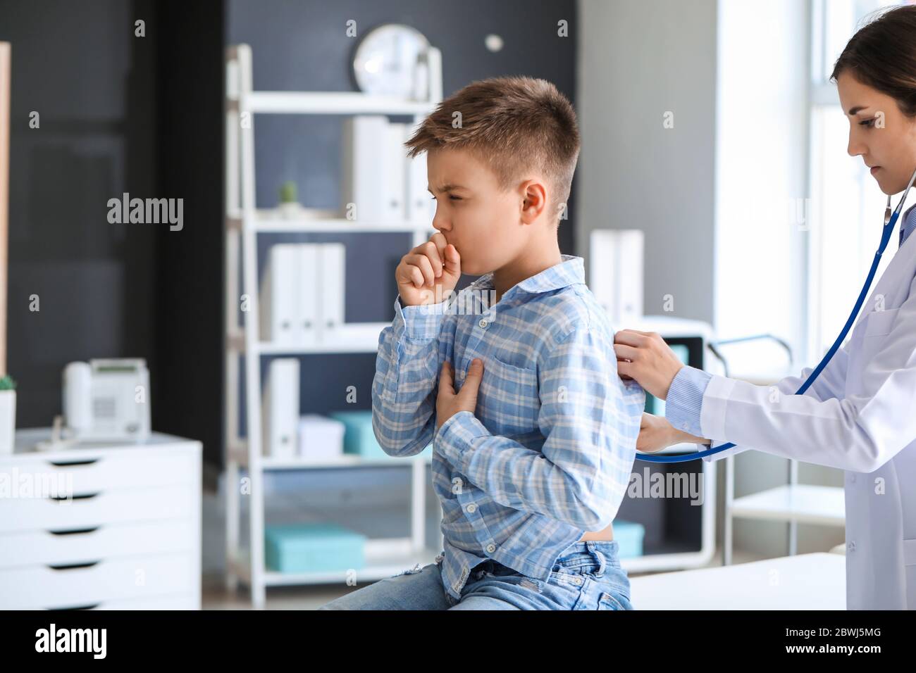 Female patient coughing at doctor hi-res stock photography and images ...