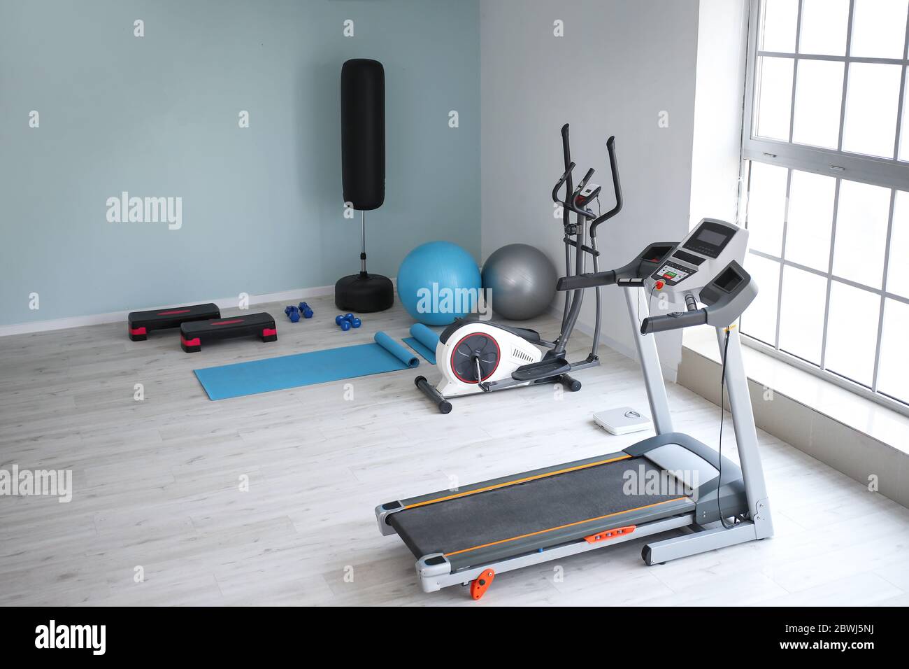 Interior of gym with modern equipment Stock Photo - Alamy