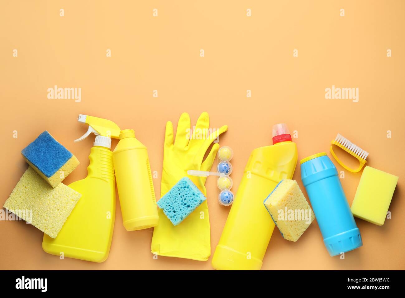Set of cleaning supplies on color background Stock Photo - Alamy