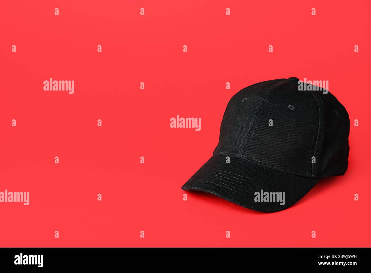 Blank cap on color background Stock Photo - Alamy