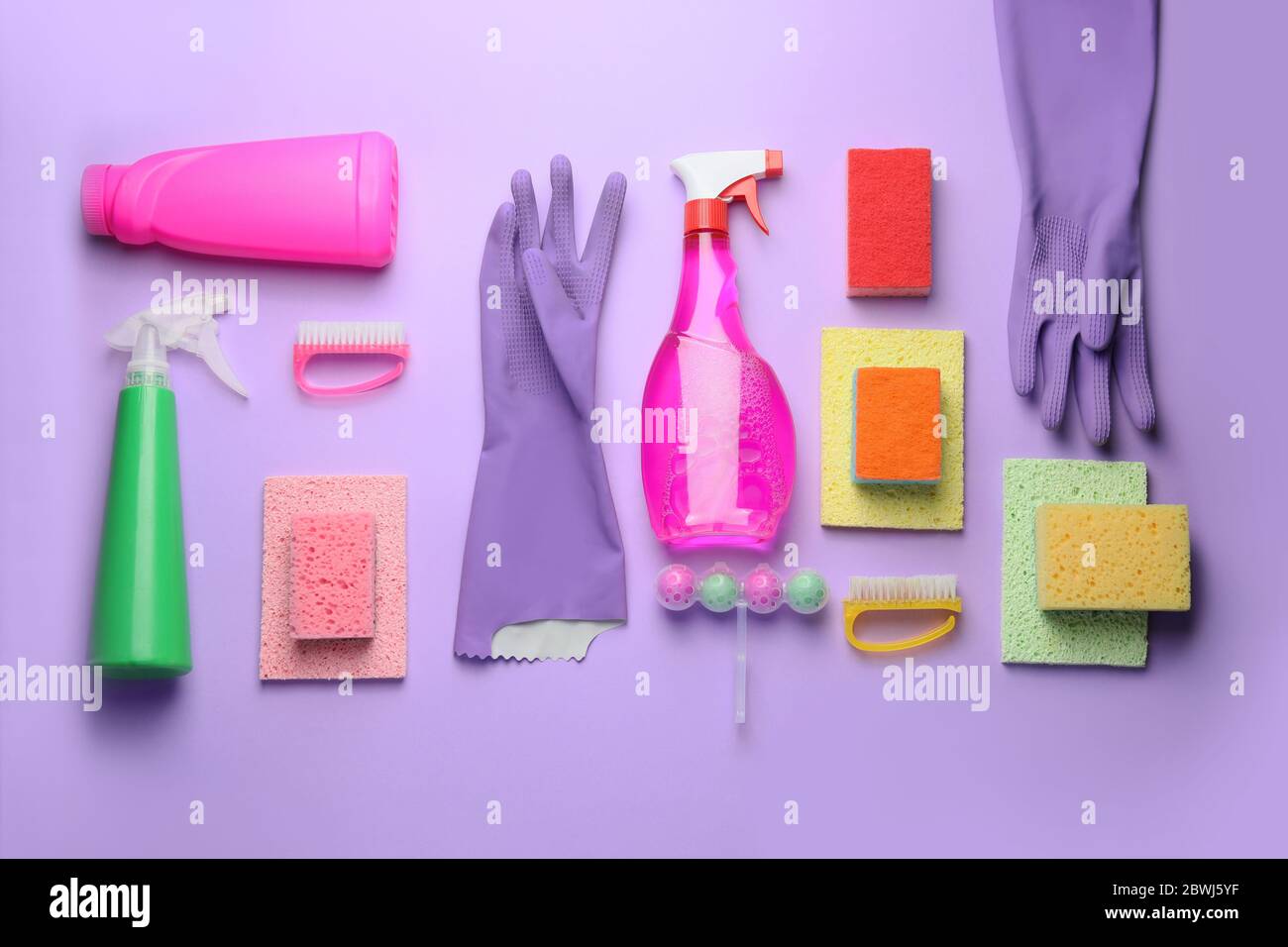 Set of cleaning supplies on color background Stock Photo - Alamy