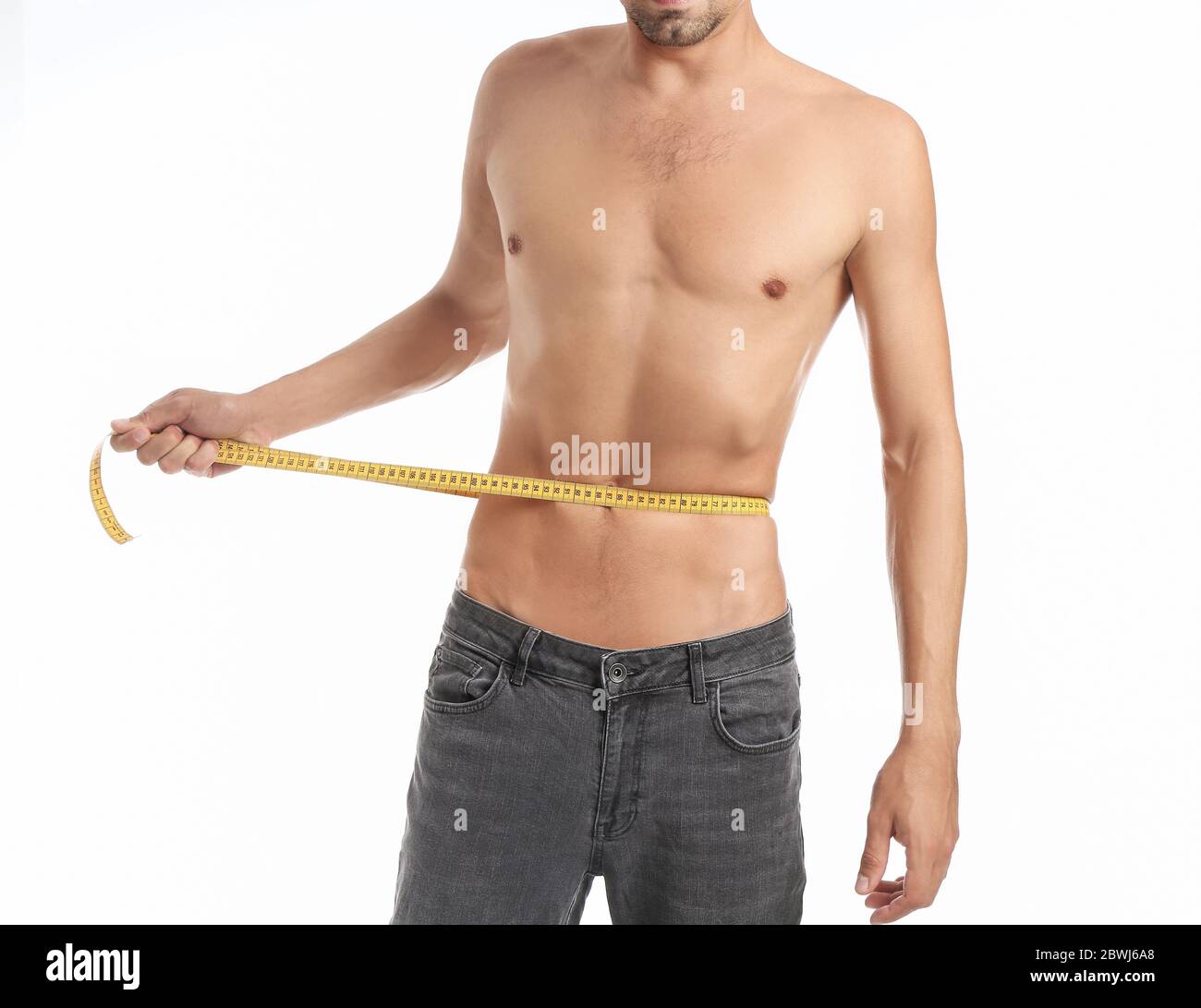 Sick man measuring his waist on white background. Concept of anorexia ...