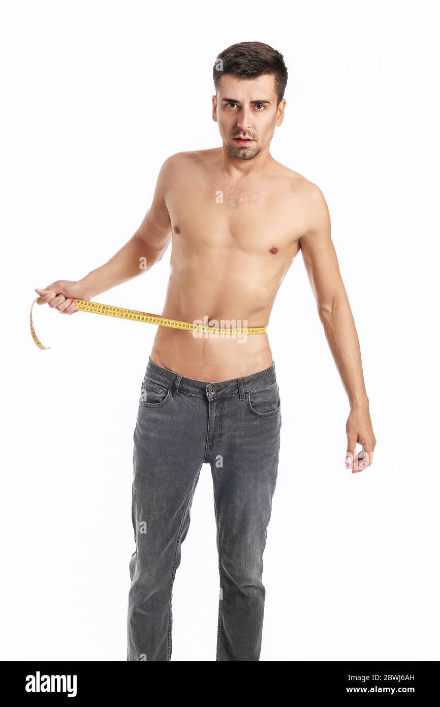 Sick man measuring his waist on white background. Concept of anorexia ...