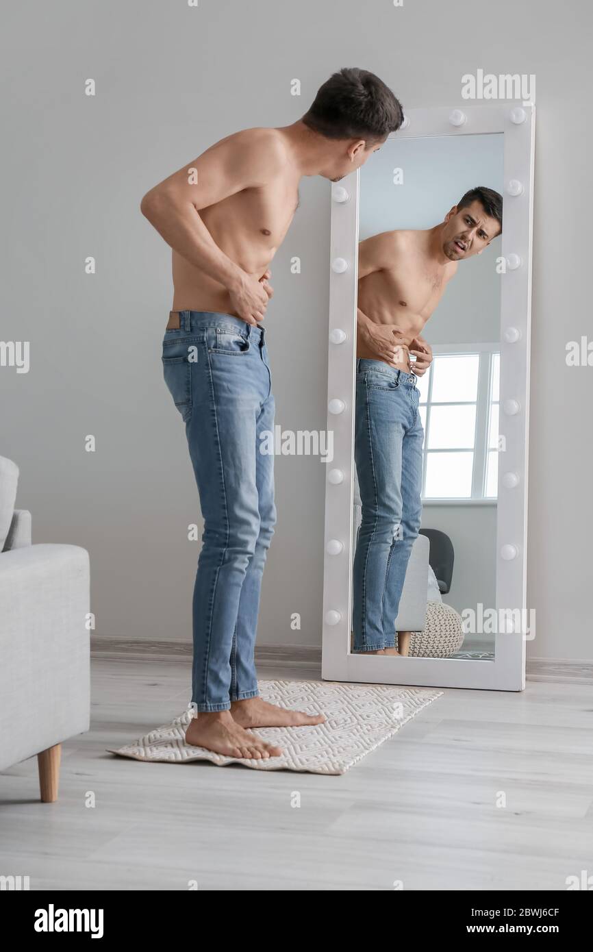 Anorexic man mirror hi-res stock photography and images - Alamy