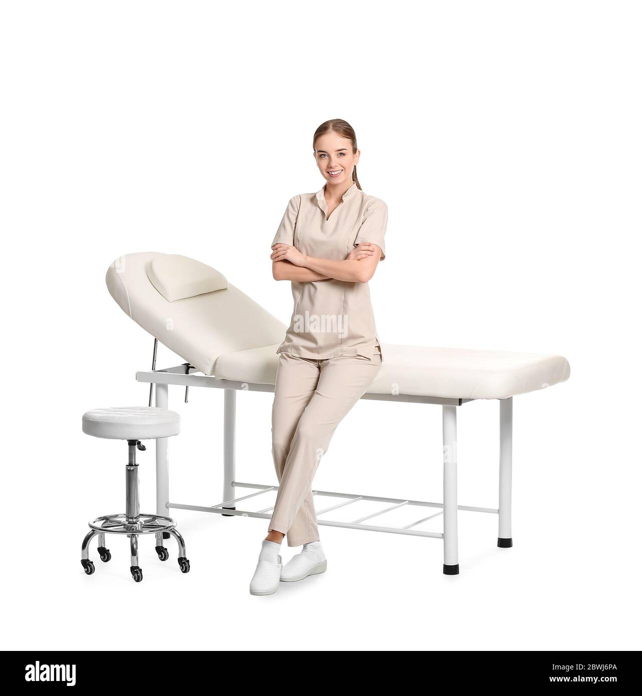 Portrait of female massage therapist on white background Stock Photo ...