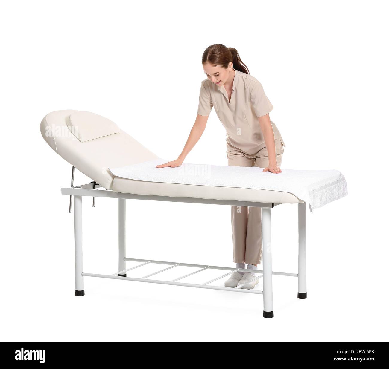 Portrait of female massage therapist on white background Stock Photo ...