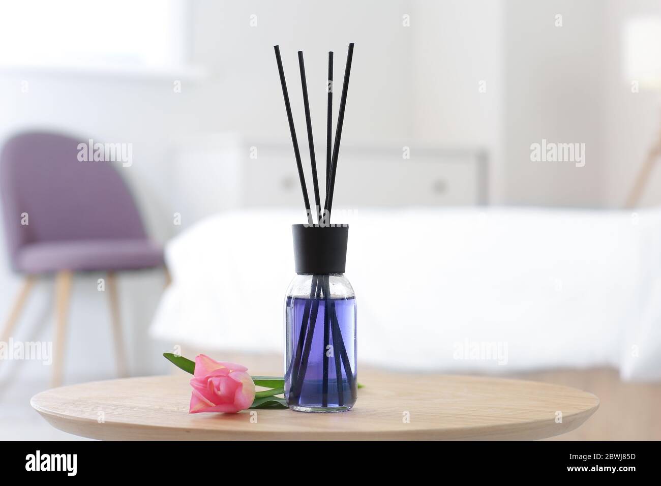 Reed diffuser on table in bedroom Stock Photo - Alamy
