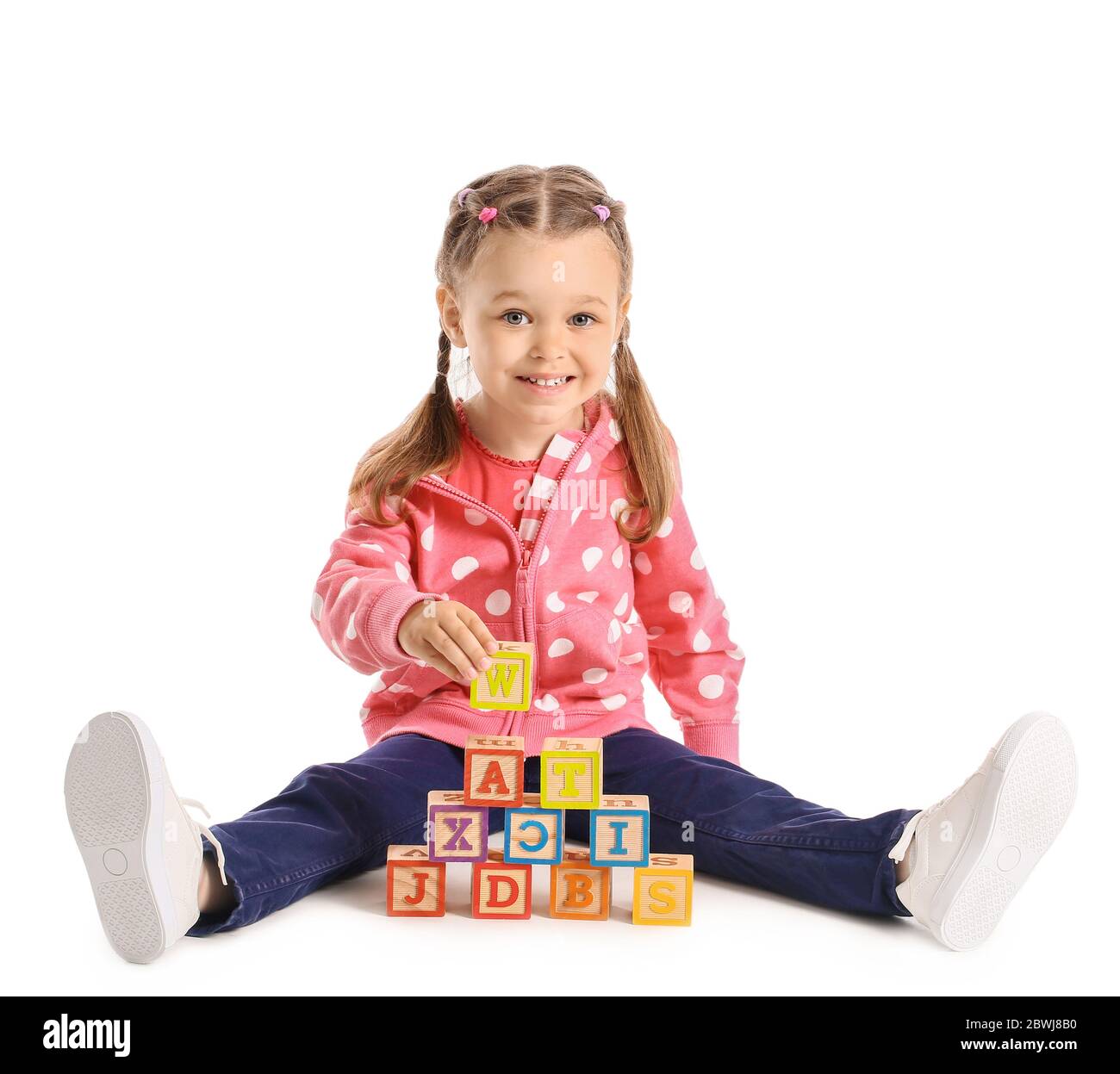 Little girl with toys on white background Stock Photo - Alamy