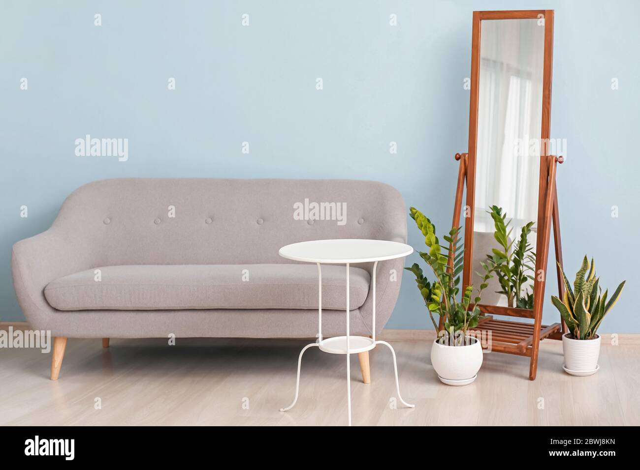 Interior of modern room with big mirror Stock Photo - Alamy