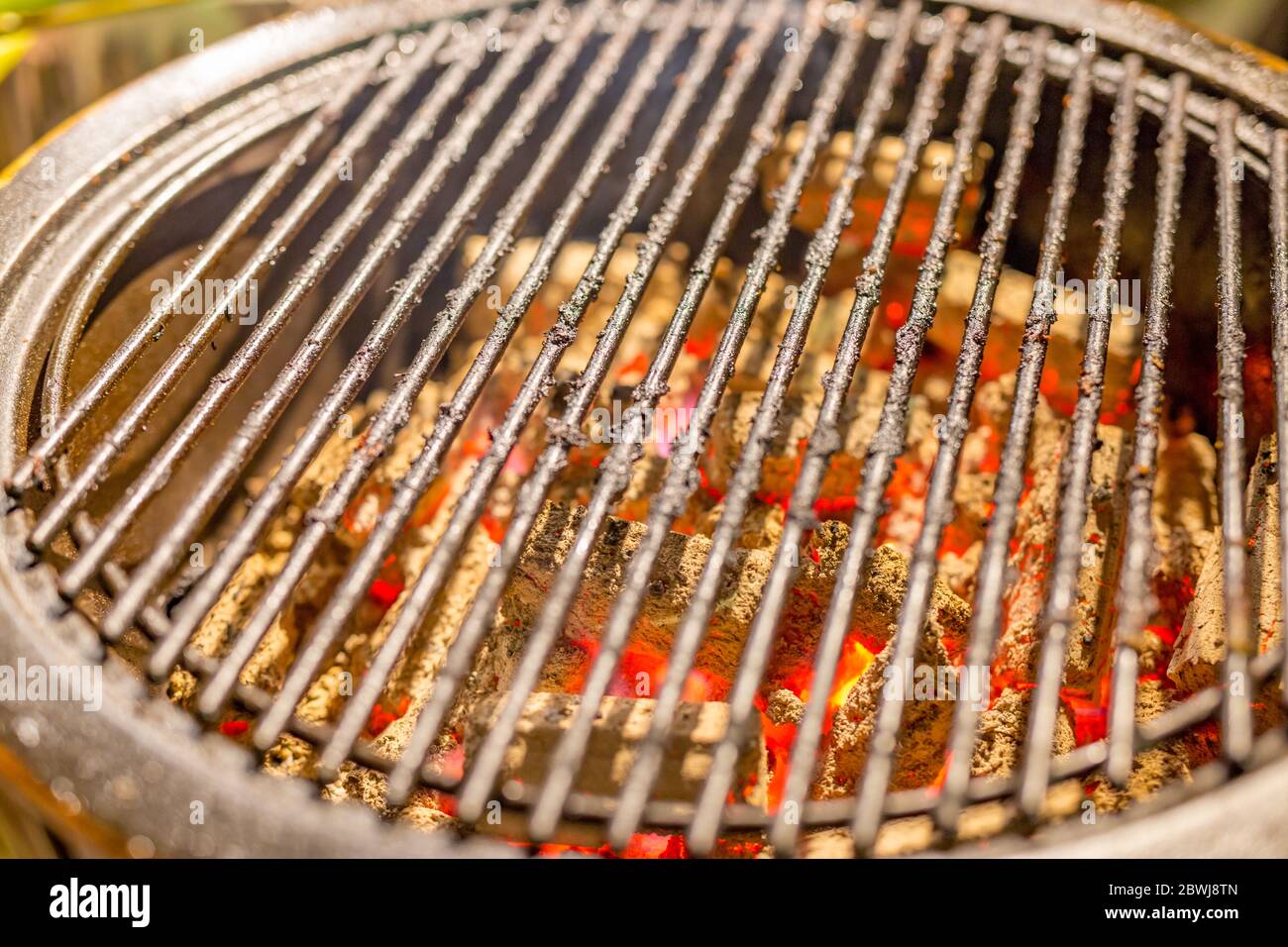 Barbecue fire with round grill. Food preparing concept with bbq fire on ...