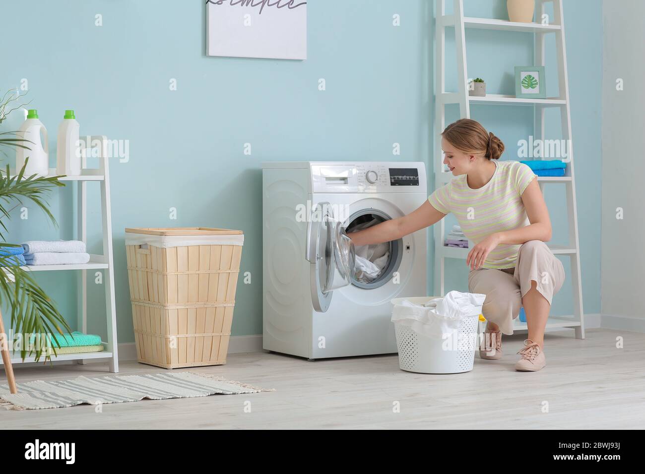 Woman unloading laundry hi-res stock photography and images - Alamy