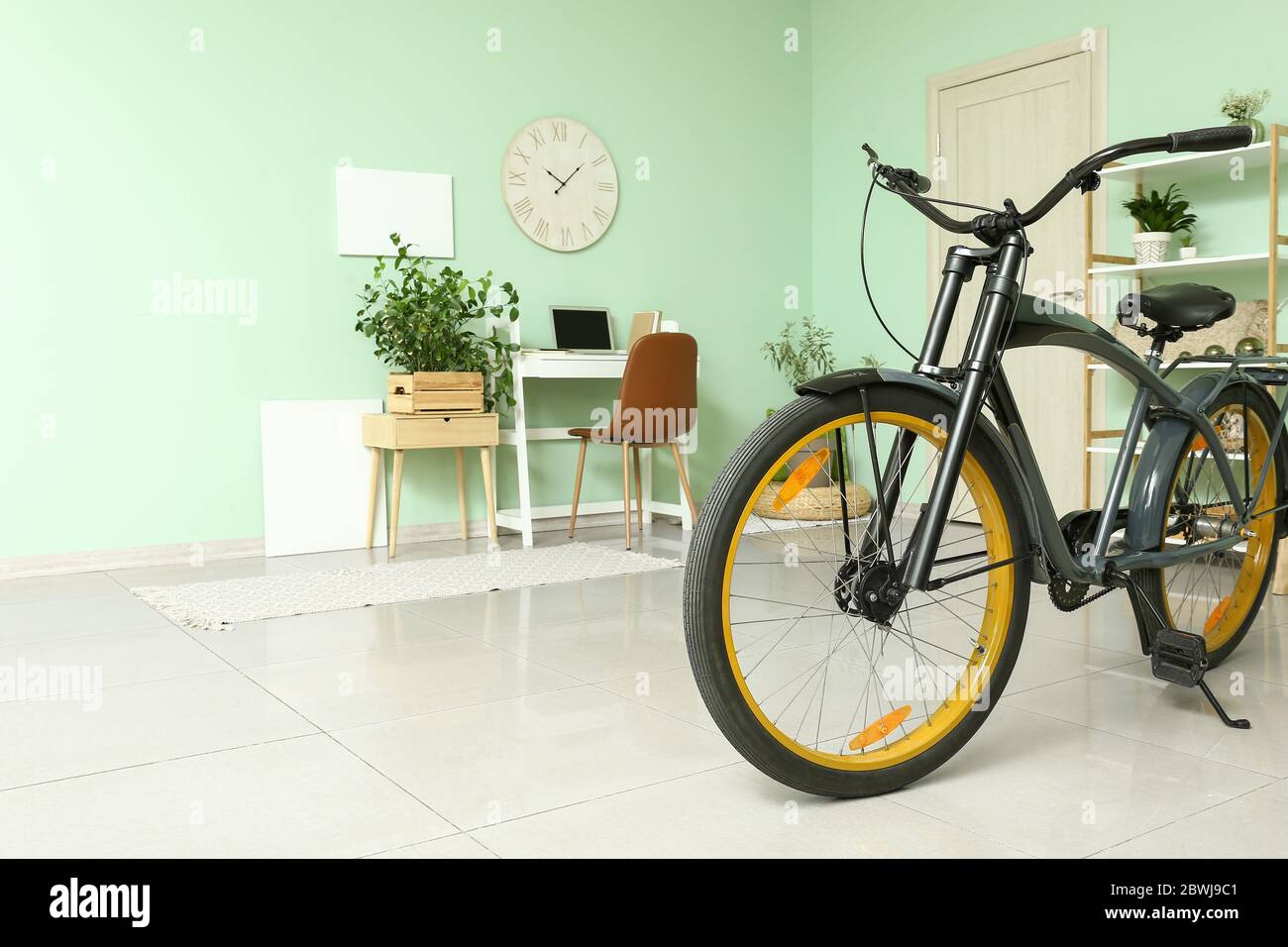 Interior of modern room with stylish bicycle Stock Photo - Alamy