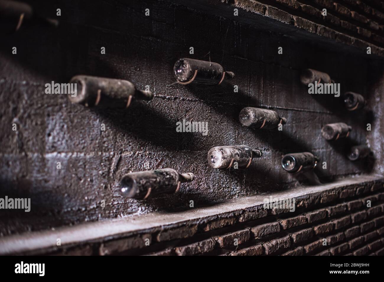 Old, ancient wine collection and dusty wine bottles in an underground ...